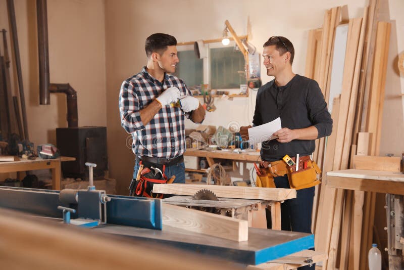 Professional Carpenters Working with Draft Stock Photo - Image of ...