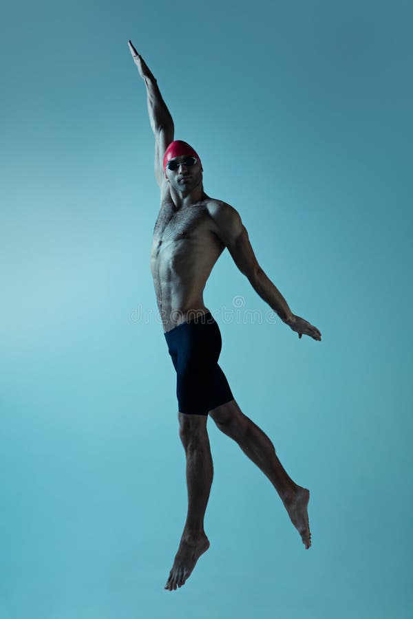 Professional Male Swimmer with Hat and Goggles in Motion and Action ...