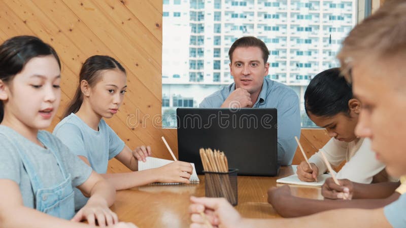 Smart Teacher Explain Homework while Diverse Student Doing Test ...