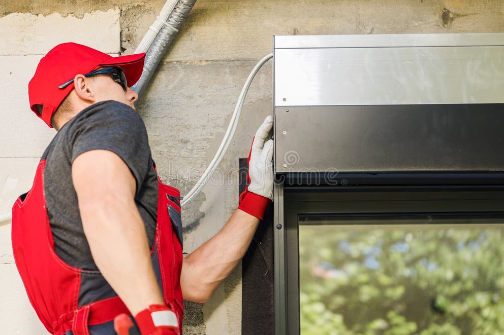 Worker Installing Automatic Outdoor Window Shutters Stock Image - Image ...