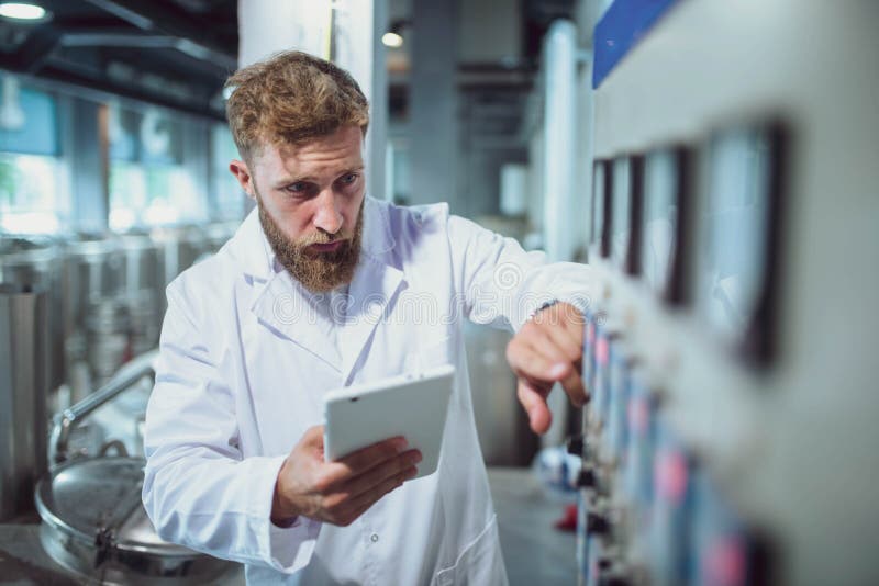 Professional Caucasian Technologist Expert Controlling Industrial ...