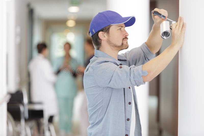 Professional Cctv Technician Working Stock Photo - Image of coveralls ...