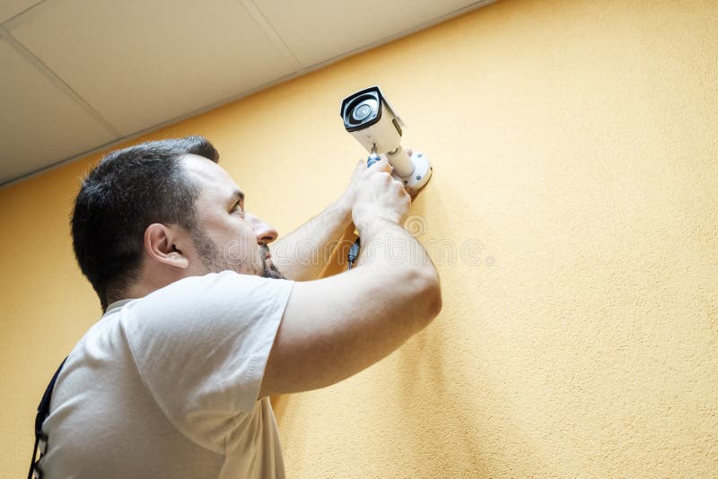 Professional CCTV Technician Working Stock Photo - Image of male, home ...