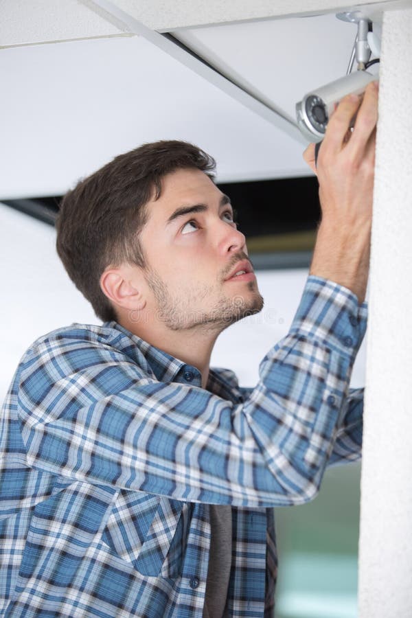 Apprentice Cctv Technician Working Stock Image - Image of caucasian ...