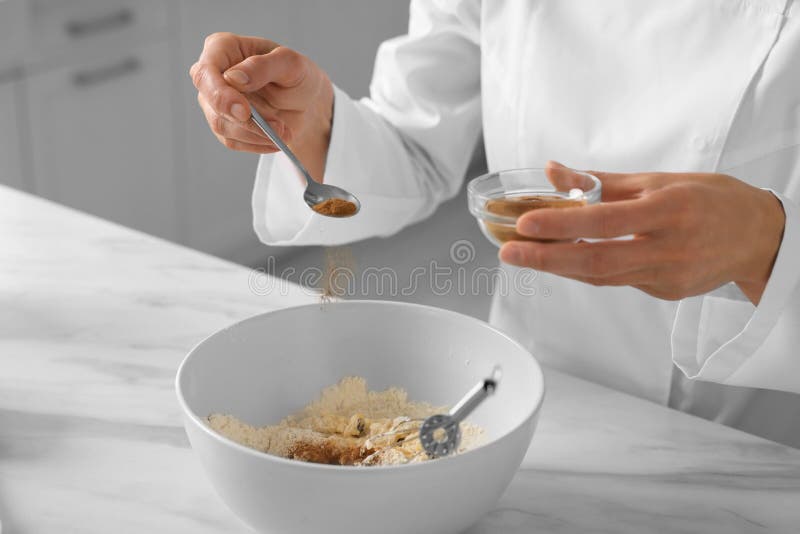Professional Chef Adding Cocoa Powder into Dough at White Marble Table ...