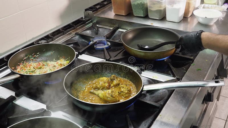 Chef Preparing Indian Curry Chicken in Professional Kitchen Stock ...