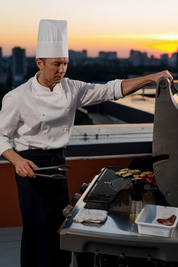 Professional Chef Cooking Bbq on Rooftop at Sunset Stock Image - Image ...