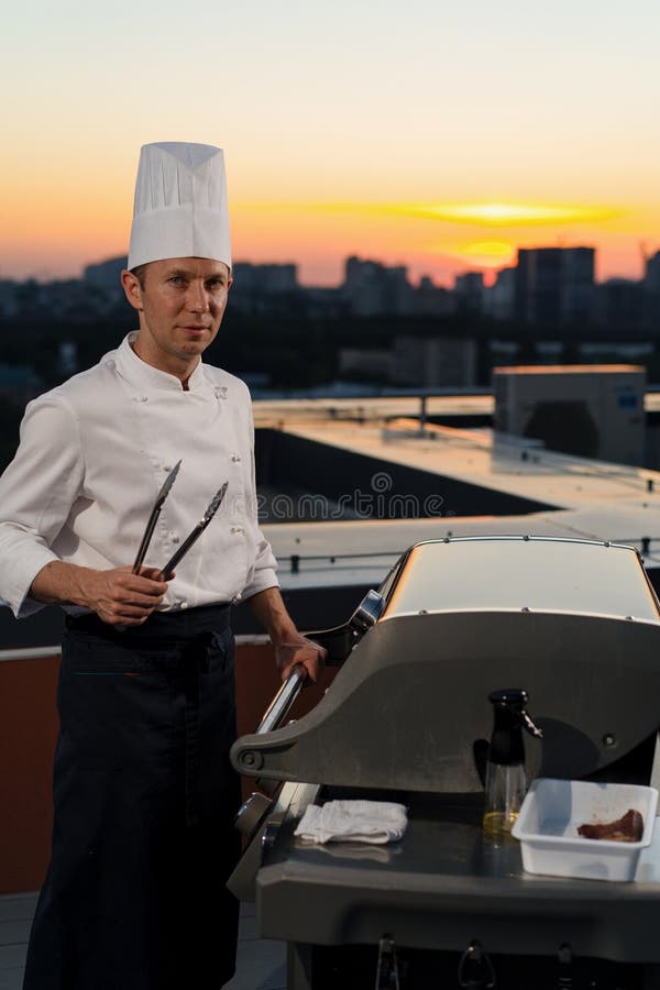 Professional Chef Cooking Bbq on Rooftop at Sunset Stock Photo - Image ...