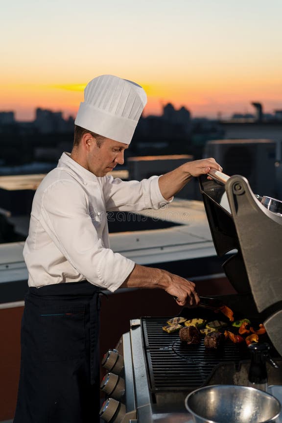 Professional Chef Cooking Bbq on Rooftop at Sunset Stock Image - Image ...