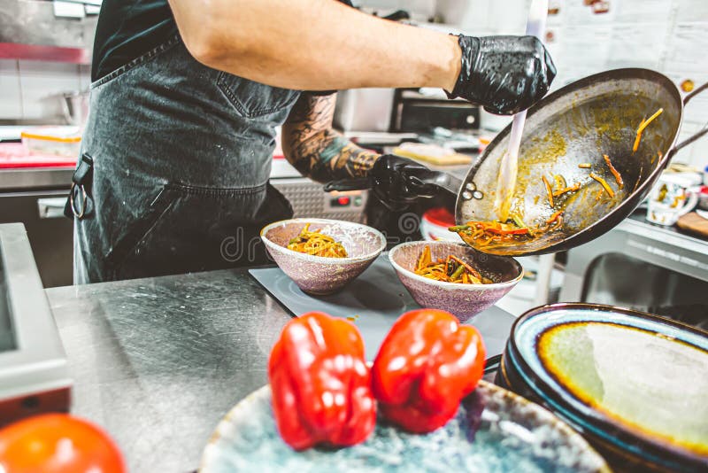 Professional Chef Cooking in the Kitchen Restaurant at the Hotel ...