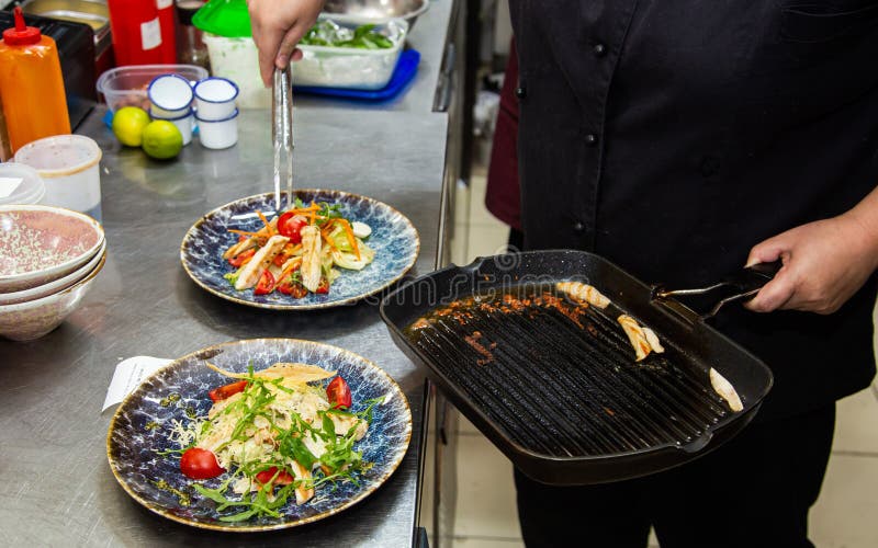 Professional Chef Cooking in the Kitchen Restaurant at the Hotel ...