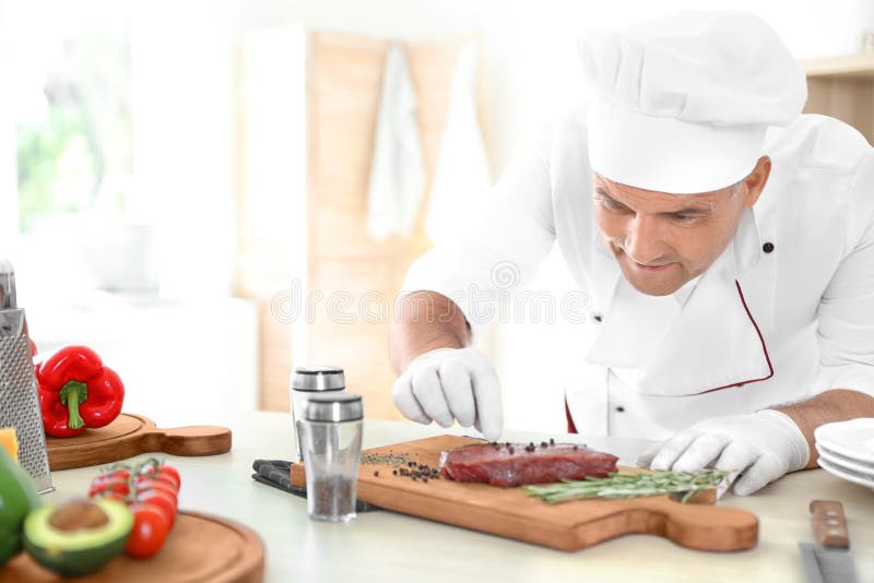 Professional Chef Cooking Meat on Table Stock Photo - Image of cuisine ...