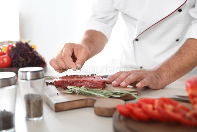 Professional Chef Cooking Meat on Table in Kitchen Stock Photo - Image ...