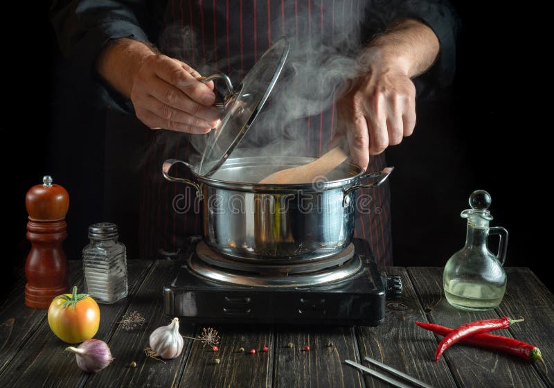 Professional Chef Cooks a Delicious Soup with Vegetables in a Hot Pot ...