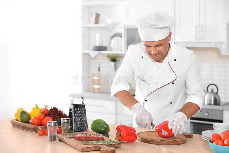 Professional Chef Cutting Pepper on Table Stock Photo - Image of ...