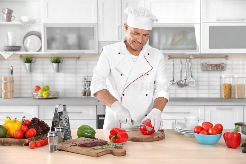 Professional Chef Cutting Pepper on Table Stock Photo - Image of meal ...