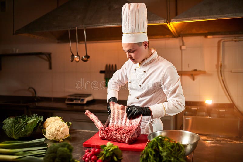 Professional Chef Cutting Raw Bbq Beef Ribs on the Background of ...