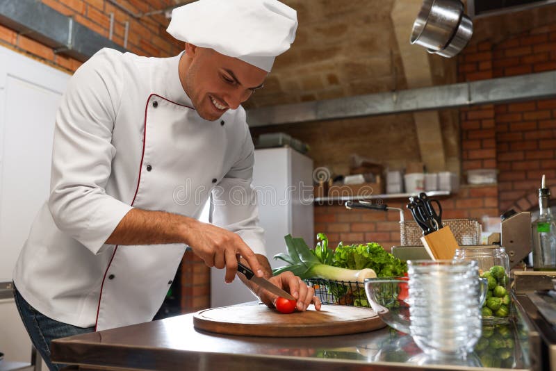 Professional Chef Cutting Fresh Tomato in Restaurant Kitchen Stock ...