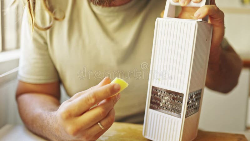 Chef Grating Ginger with a Manual Grater in the Kitchen Stock Footage ...