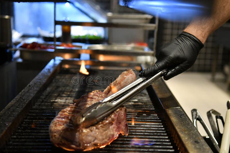 Professional Chef Making Delicious Steak at a Restaurant Stock Image ...