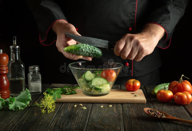 A Professional Chef Prepares a Vegetable Salad in a Restaurant Kitchen ...