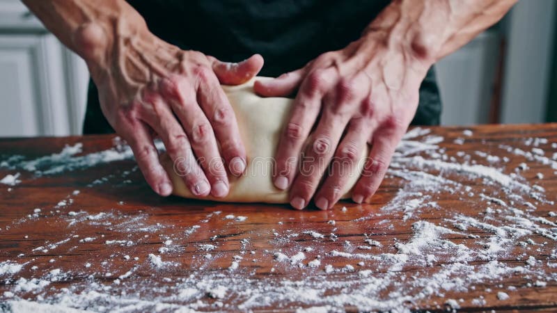 Baker Kneading Dough on Floured Wooden Table with Skilled Handiwork ...