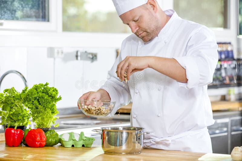Professional Chef Preparing Dish in Large Kitchen Stock Photo - Image ...