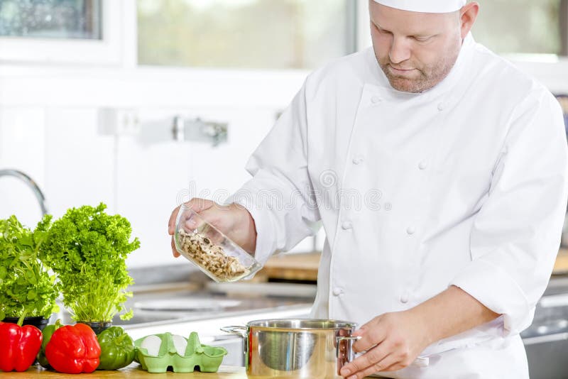 Professional Chef Preparing Food in Large Kitchen Stock Photo - Image ...