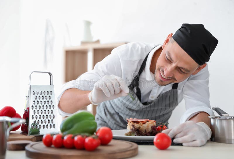 Professional Chef Presenting Dish on Table Stock Photo - Image of menu ...