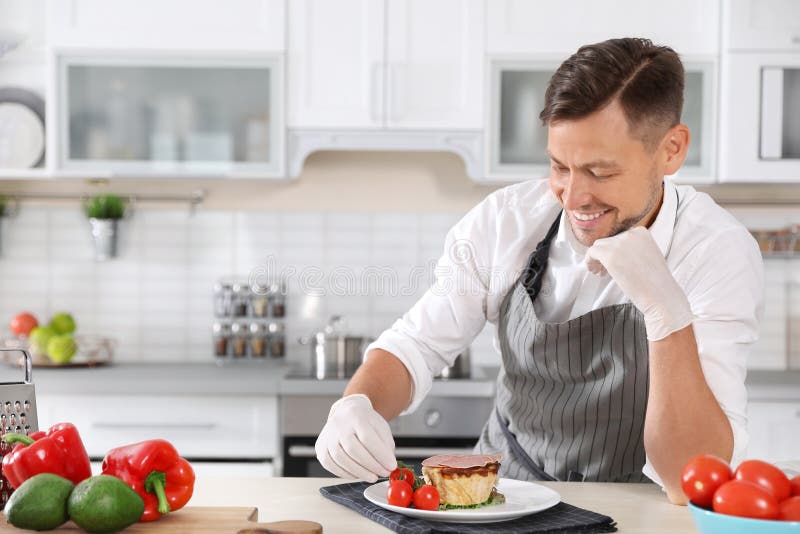 Professional Chef Presenting Dish on Table Stock Photo - Image of ...