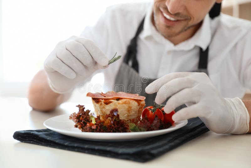 Professional Chef Presenting Dish on Table in Kitchen Stock Image ...