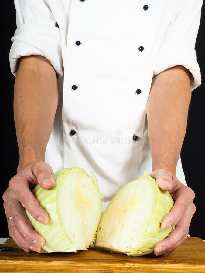 Professional Chef Showing a Cabbage Cut into Two Pieces Stock Image ...