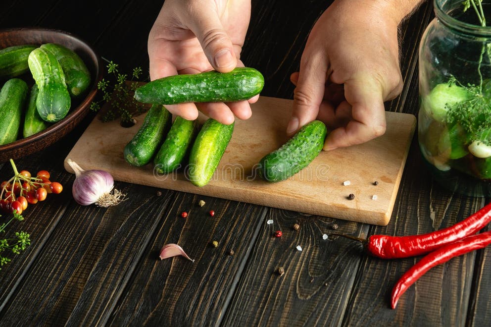Professional Chef Sorts Cucumbers before Canning in a Jar. Work ...
