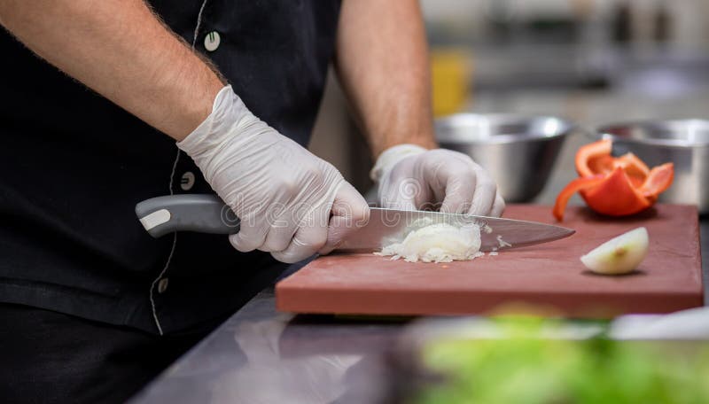 Professional Chef in Uniform Preparing Fresh Vegetables on Cutting ...