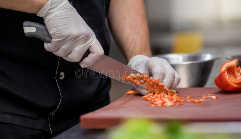Professional Chef in Uniform Preparing Fresh Vegetables on Cutting ...