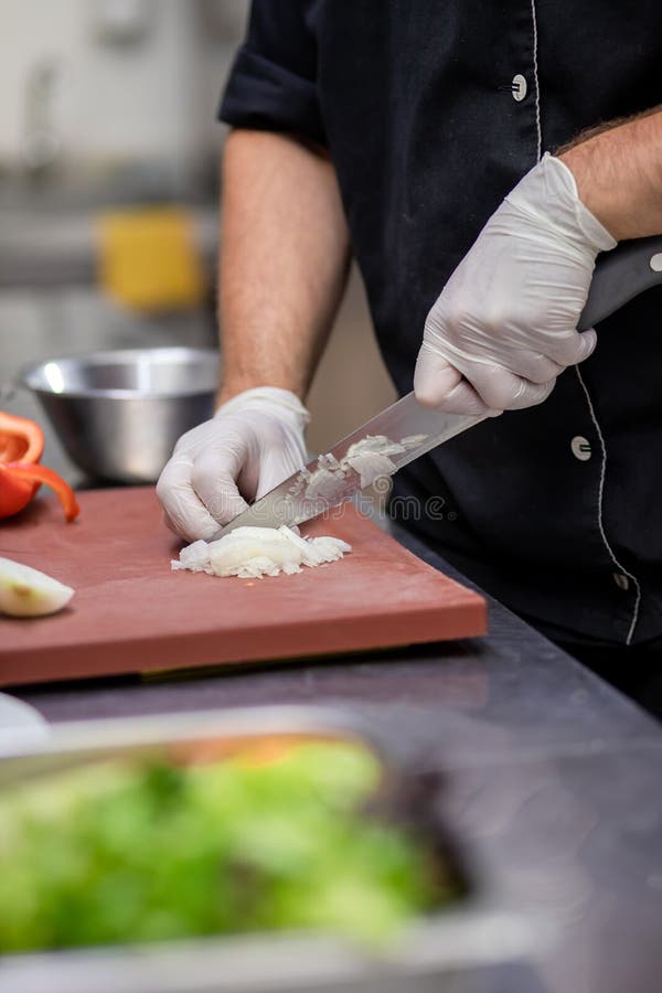 Professional Chef in Uniform Preparing Fresh Vegetables on Cutting ...