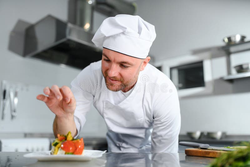Professional Chef Working in a Famous Restaurant Kitchen Stock Photo ...