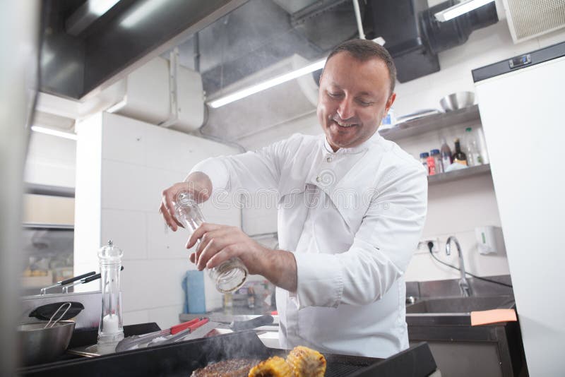 Professional Chef Working at Restaurant Kitchen Stock Photo - Image of ...