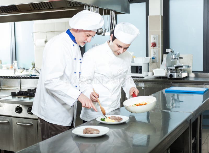 Professional chefs at work stock photo. Image of profession - 30419452
