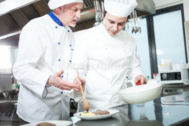 Professional chefs at work stock image. Image of light - 30419461