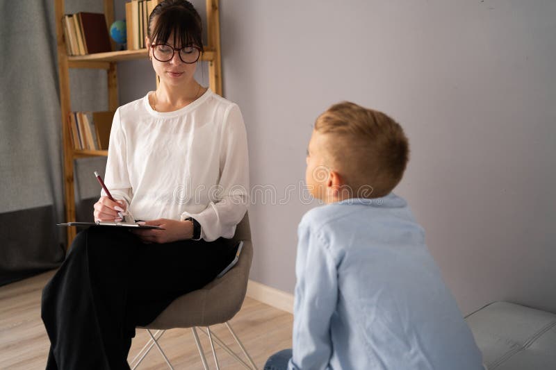 Professional Child Psychologist Working with Boy at Office Stock Image ...