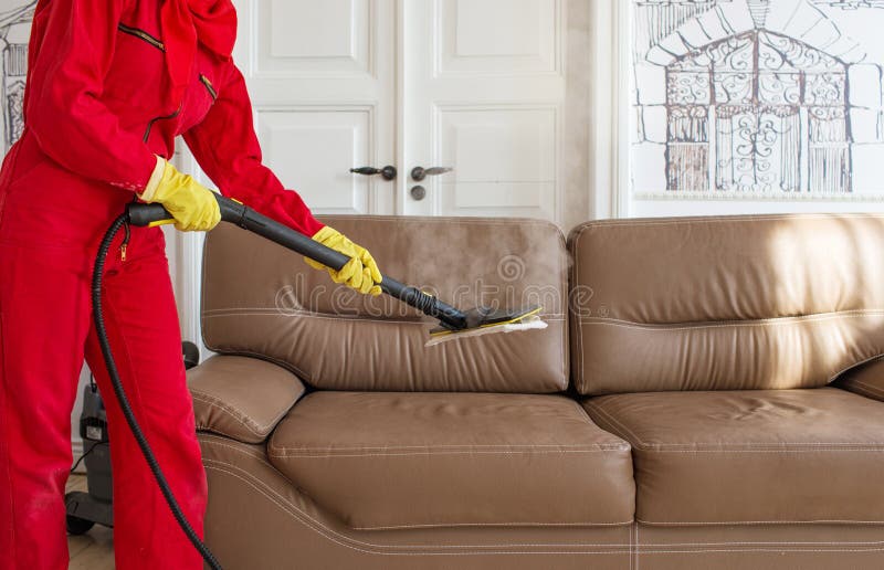 A Professional Cleaner in a Red Uniform at Her Work, with a Steam ...