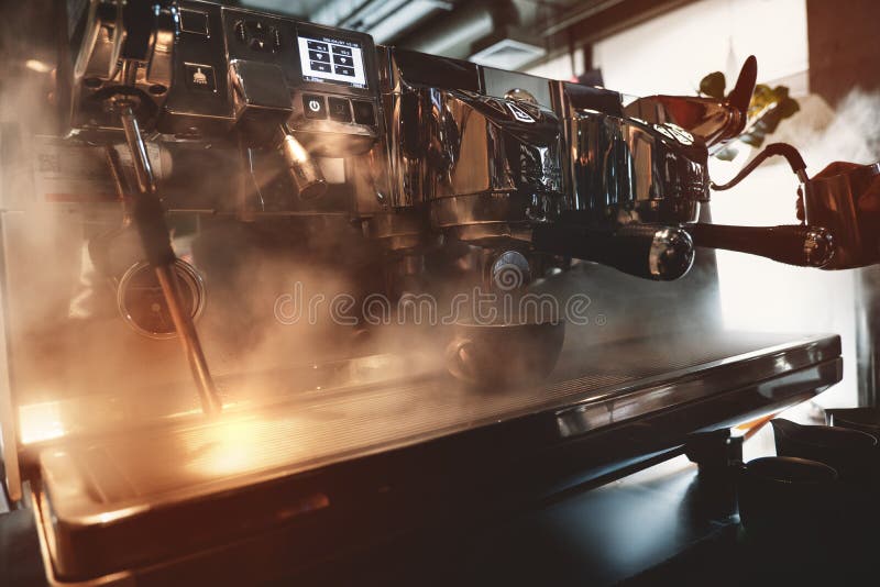 Professional Coffee Machine in Steam while Barista Making Coffee Drink ...