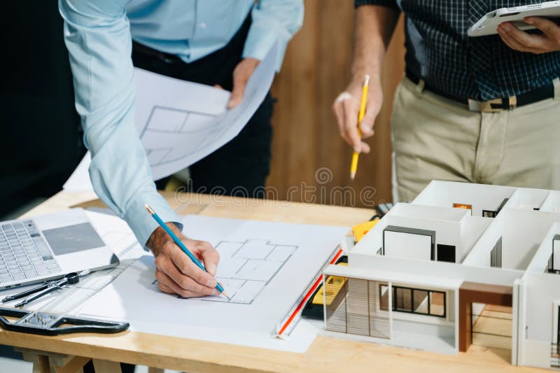 Professional Collaboration in Architecture. Two Engineers Work on ...