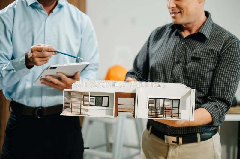 Professional Collaboration in Architecture. Two Engineers Work on ...