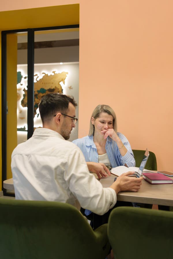 Professional Collaboration between Colleagues in a Modern Office Space ...