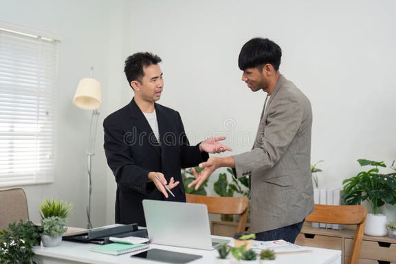 Professional Collaboration and Document Review. Two Men Discussing Key ...