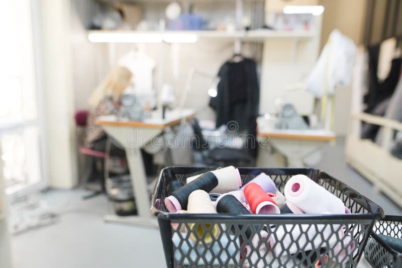 Professional Colored Threads are on the Table in a Basket Against the ...