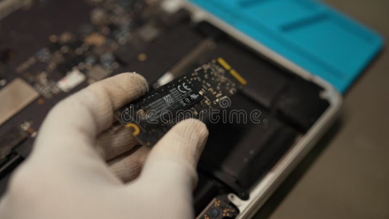 Professional Computer Master Holding Solid State Drive (ssd) Above Open ...
