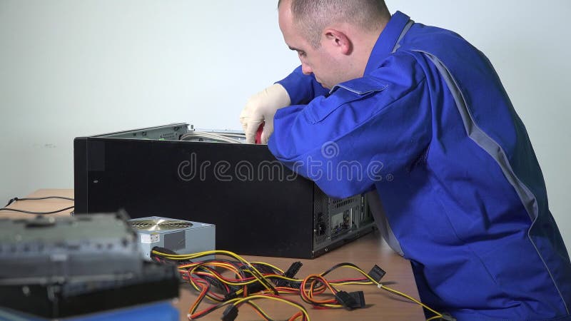 Computer Repairer Put Protective Gloves on Hands. Computer Case and ... Computer Repairer Put Protective Gloves on Hands. Computer Case and ...